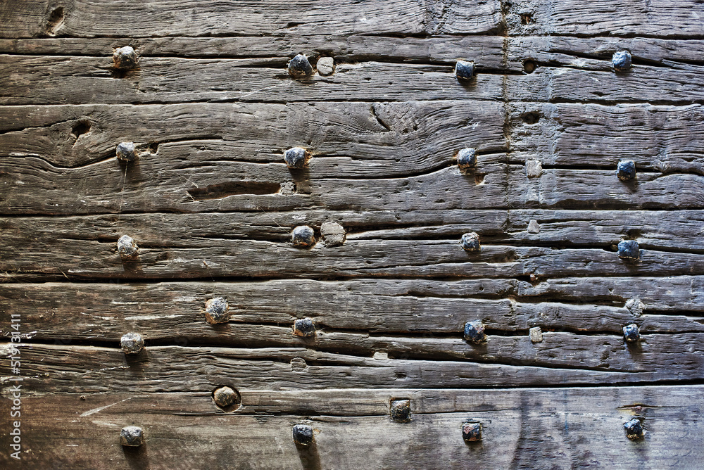 Wooden texture of the gate of the ancient castle. A thousand-year-old ...