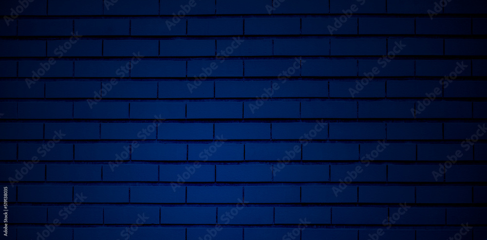 Brick wall with dark blue color and spotlight on surface as background ...