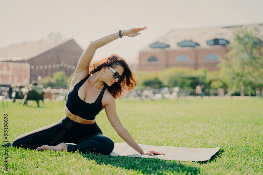 Horizontal shot of motivated young female model has regular morning ...