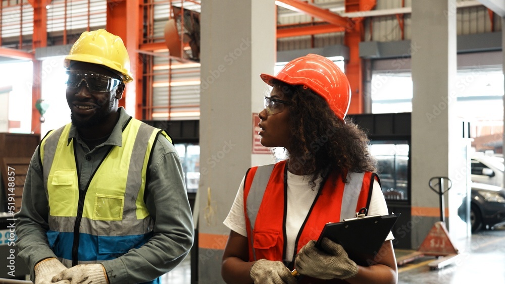 Two engineer worker together, Woman talking and pointing with Man. Two ...
