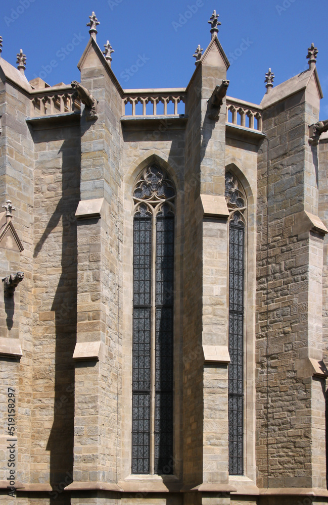 Pointed window with gothic tracery and buttress construction at the ...