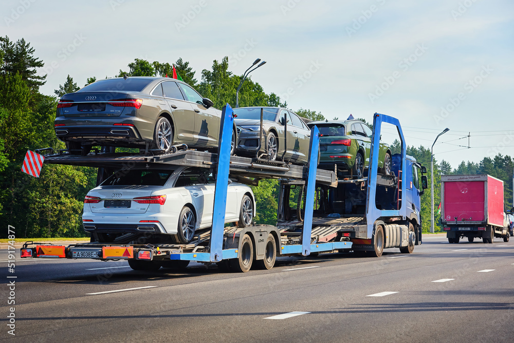 Minsk, Belarus. Jul 2022. Tractor trailer hauling new Audi A6 vehicles ...