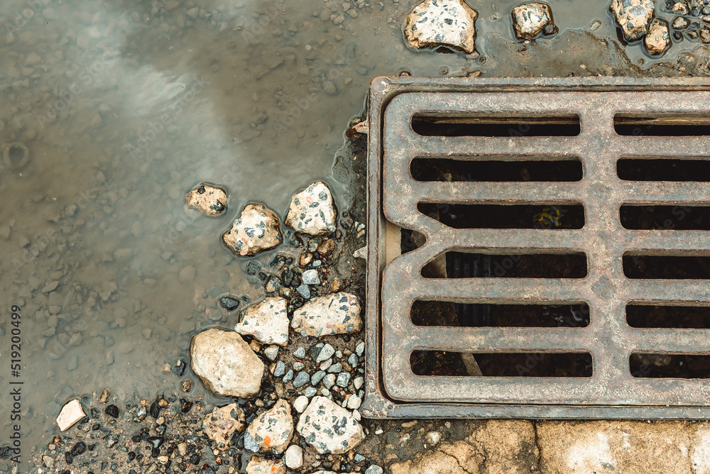 Water drains from the drain hatch. Drainage fountain of sewage ...