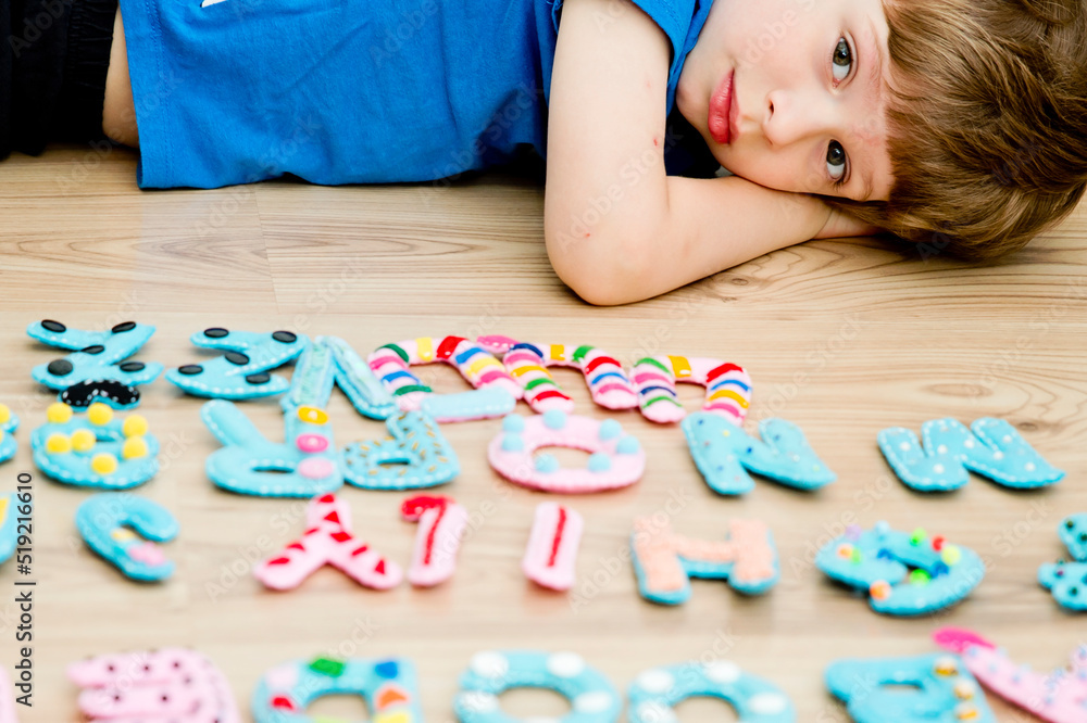 Full of sensory alphabet in capital letters made from stuffed felt. Toy ...