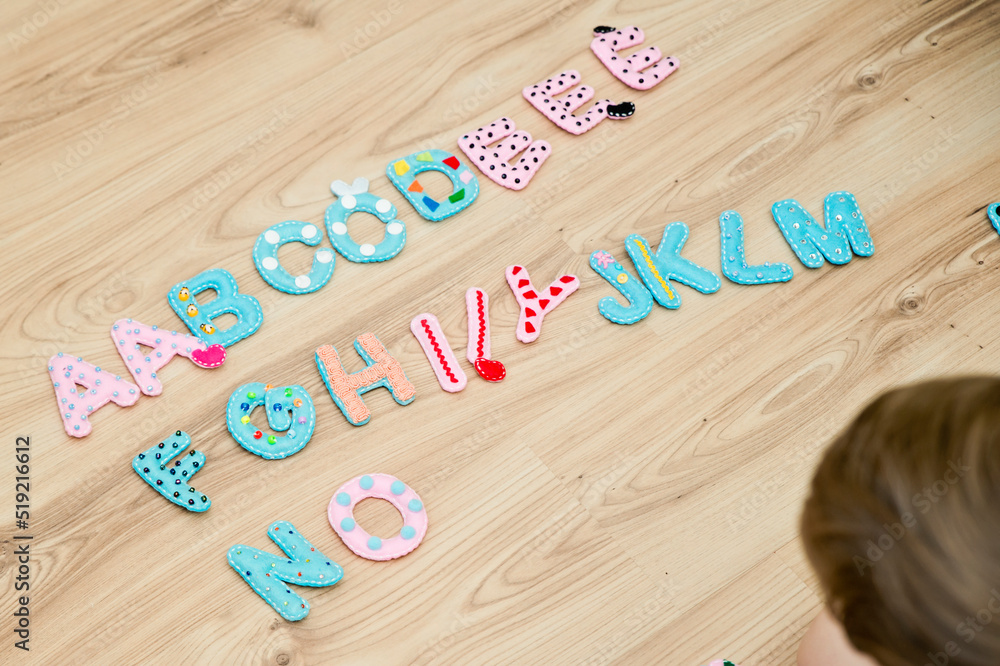 Full of sensory alphabet in capital letters made from stuffed felt. Toy ...