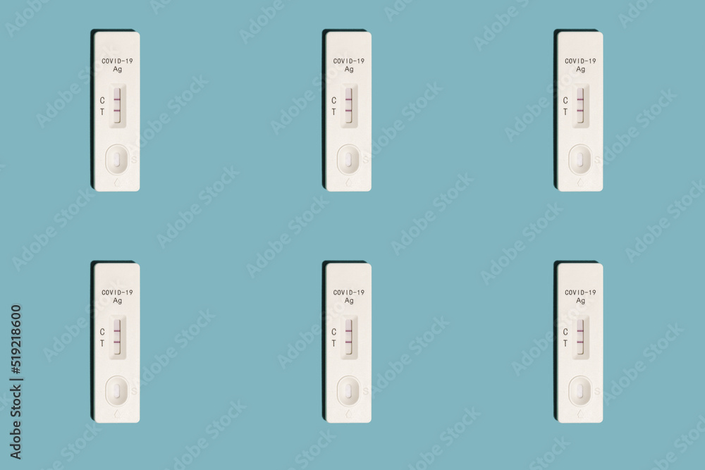 Positive Covid-19 antigen test pattern on light blue background with ...