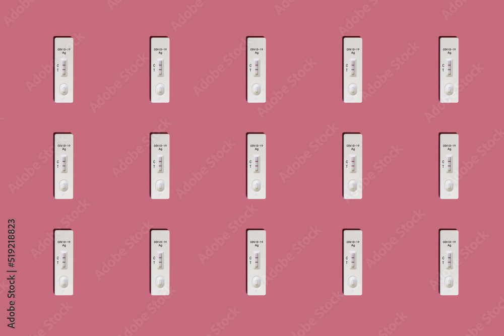 Positive Covid-19 antigen test pattern on pink background with harsh ...
