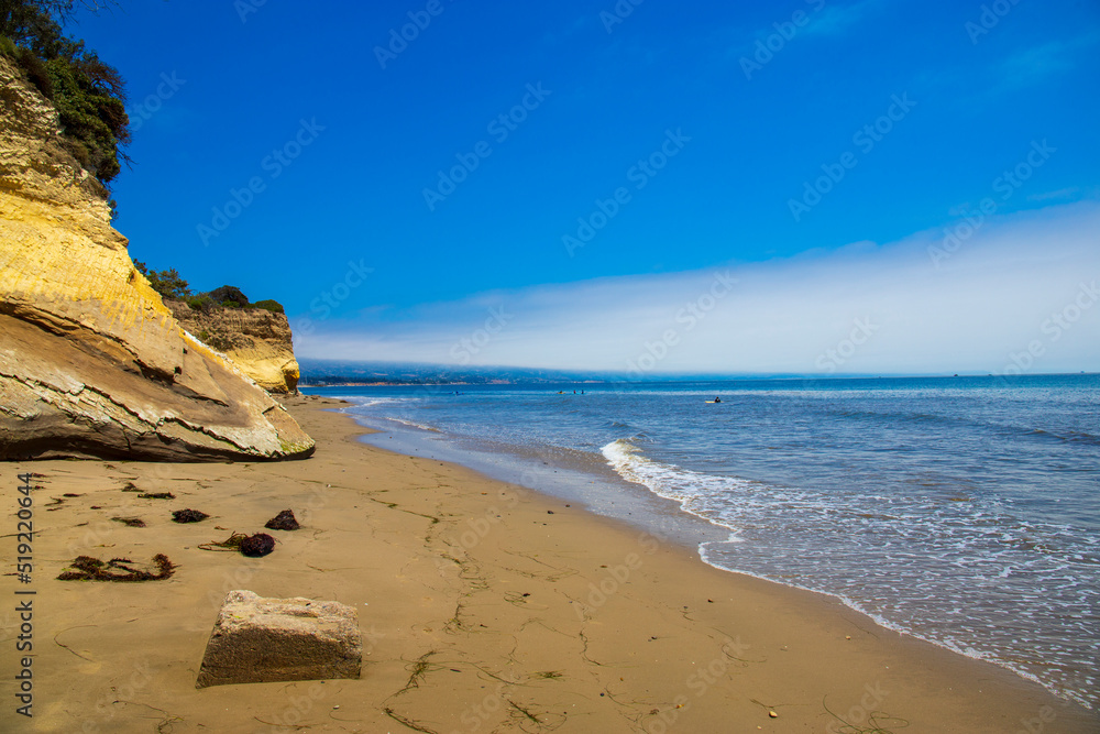 gorgeous summer landscape at the beach with rocky cliffs covered in ...