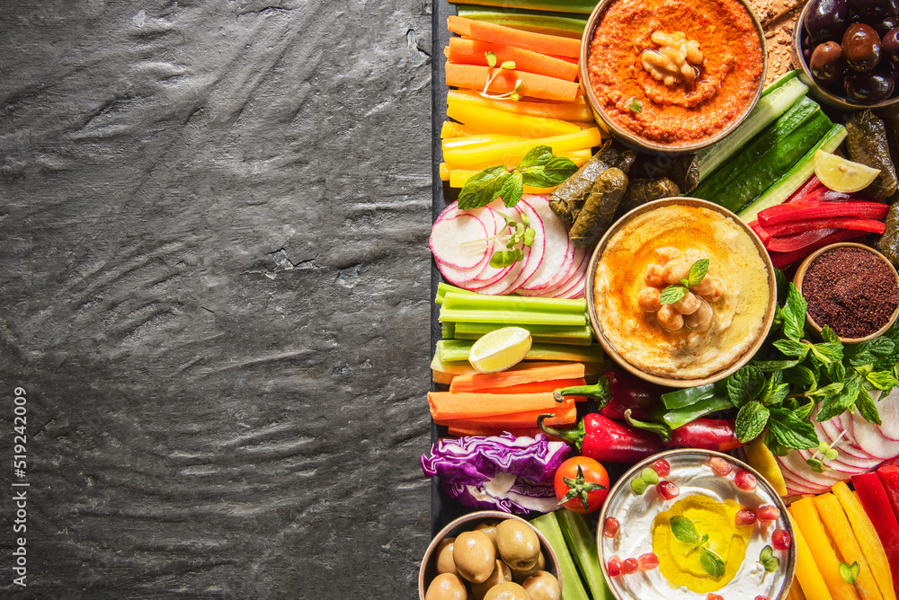 Arabic Cuisine; Middle Eastern meze platter with green falafel, pita ...