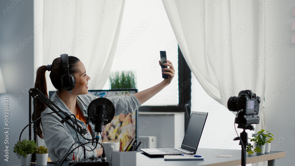 Famous internet influencer taking selfie photo with smartphone while ...