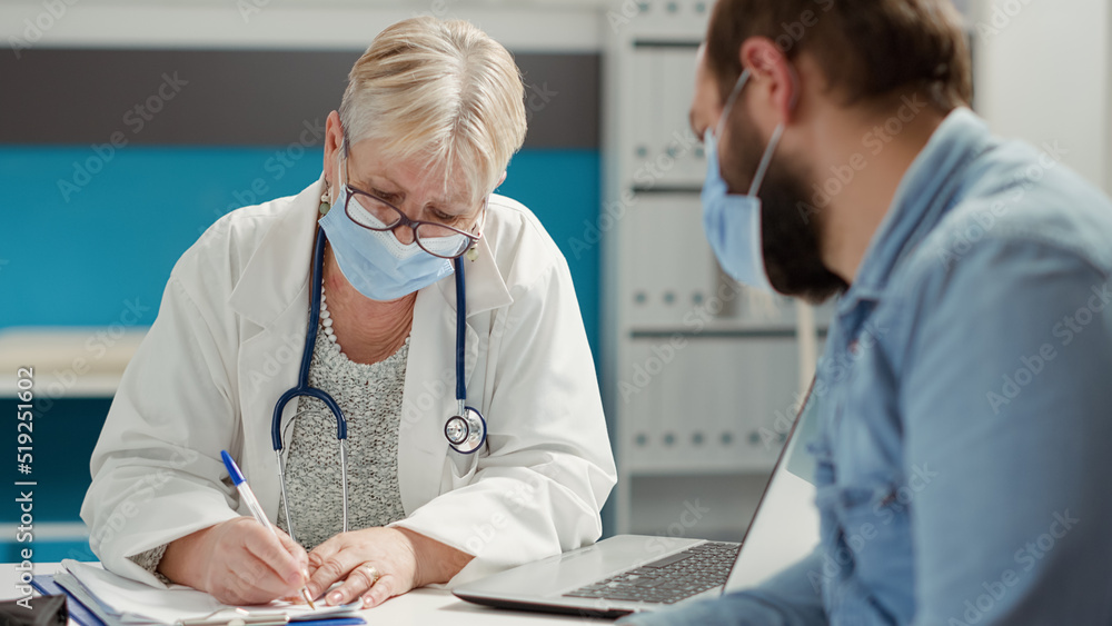Doctor and patient attending checkup consultation in office to have ...