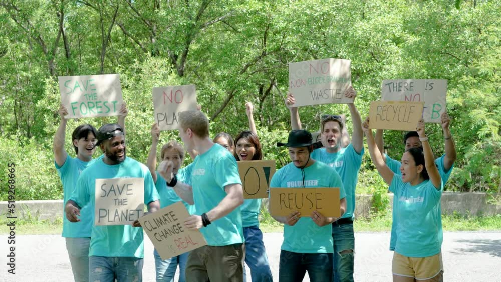 Volunteer group of people from different culture and carry posters for ...