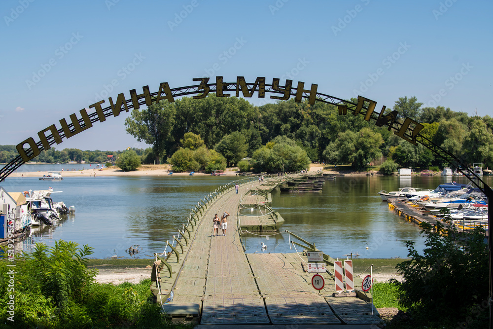 People walk over Serbian Army pontoon bridge connecting Zemun ...