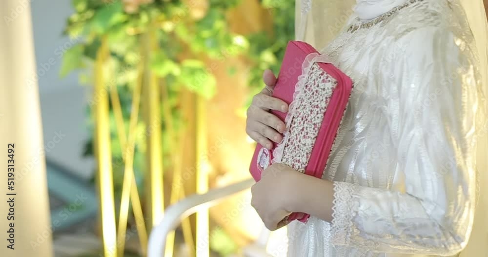 Young Pious Beautiful Muslimah Woman Wearing white veil - Holding and ...