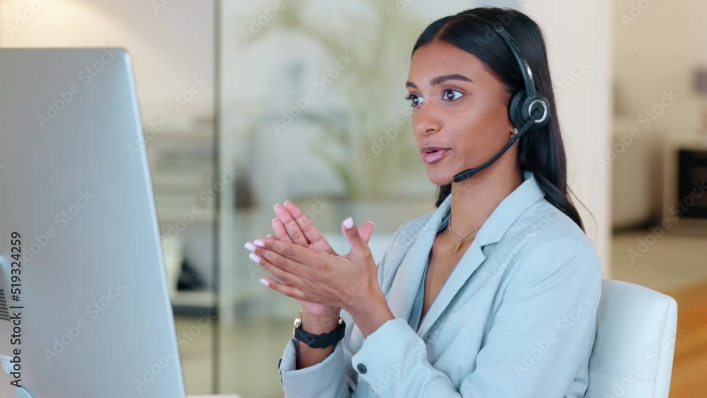 Call center agent talking and advising clients while working on a ...