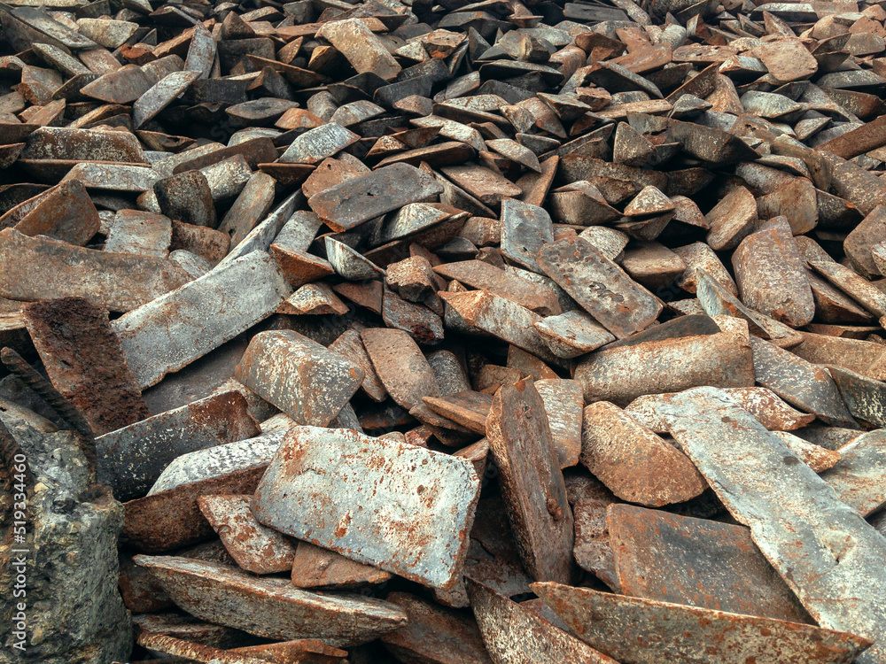 Ingots of cast iron stored in the warehouse. The form of cast iron ...