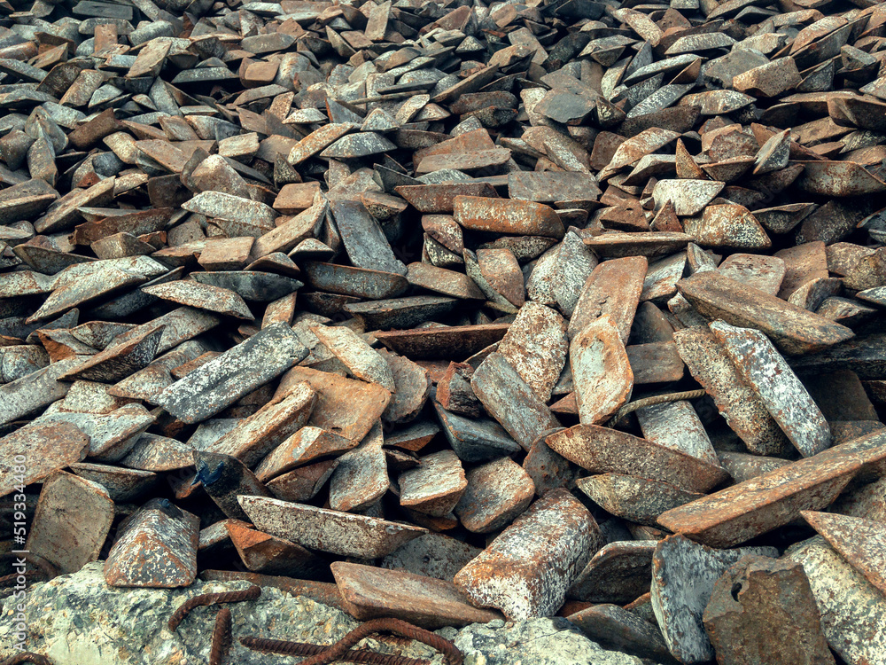 Ingots of cast iron stored in the warehouse. Cast iron obtained by ...