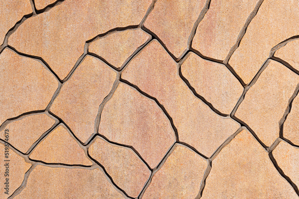 Facing concrete tiles imitating irregularly shaped natural stone. The ...