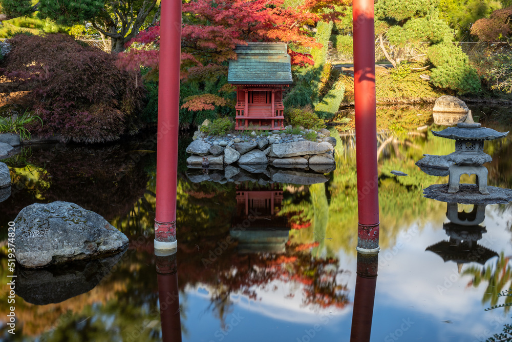 Reflection in Japanese Garden Pond of Red Pagoda and Torii Gate in ...