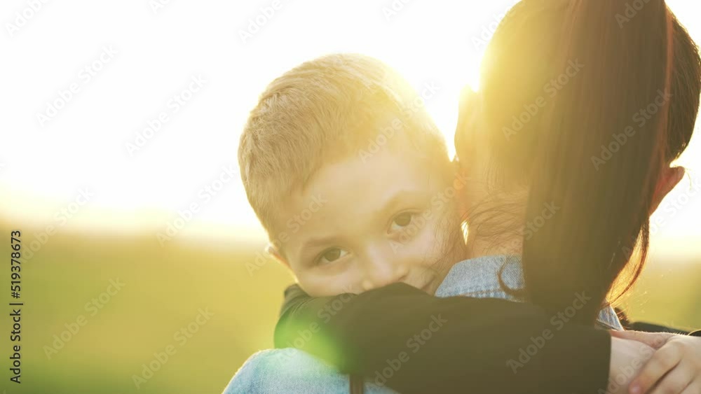 Happy harmonious family in the open air. The mother holds the child in ...