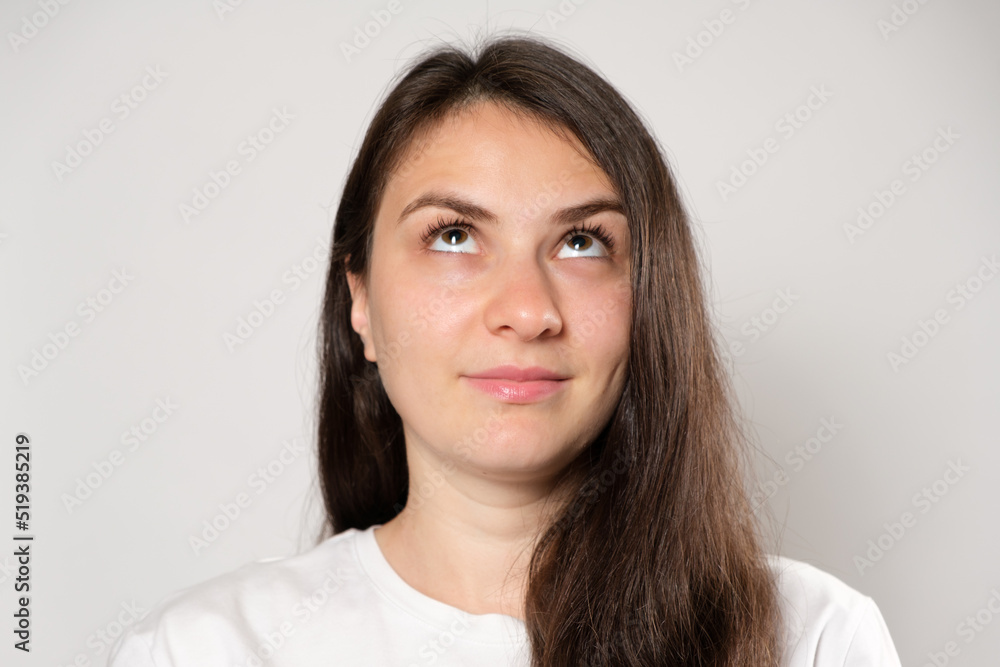 The woman looks up, does exercises for the eyes. Eye muscle training ...