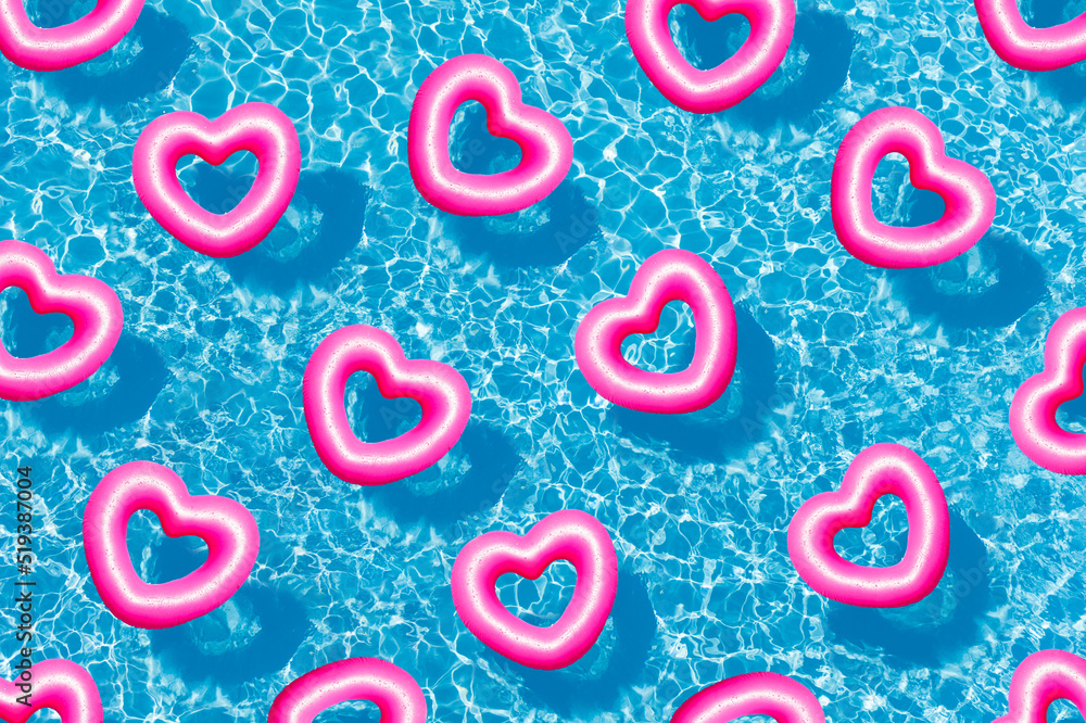 Pool with many pink buoys floating of heart shape from above Stock ...