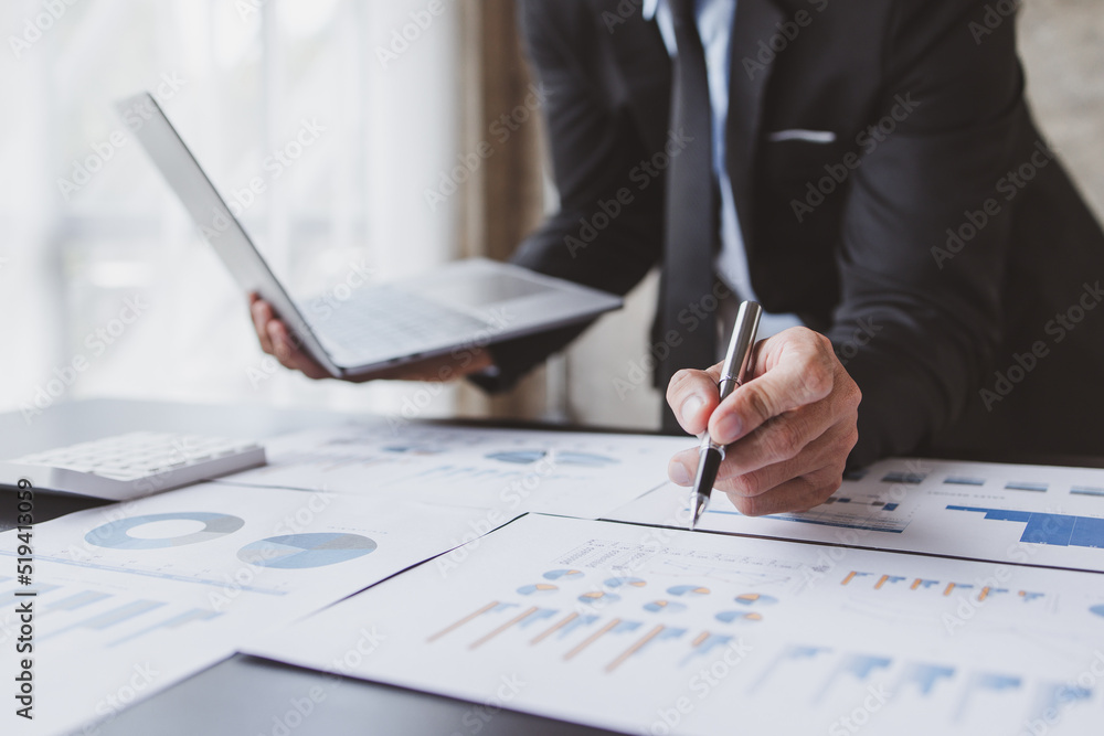 Business Accountant working on desk using calculator for calculate Tax ...
