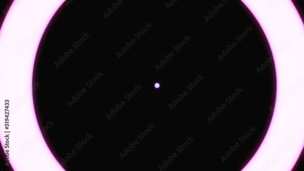 Abstract transforming neon pink rings isolated on a black background ...