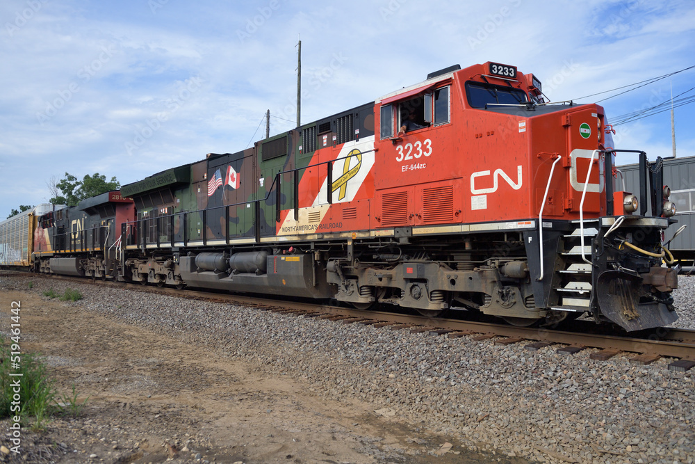 Locomotives, led by a specially painted unit honoring veterans, power a ...