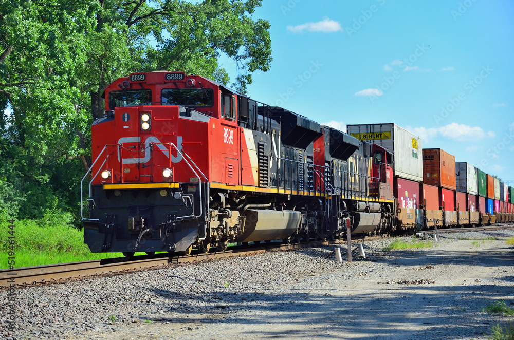 Locomotives leading an intermodal freight train through northeastern ...