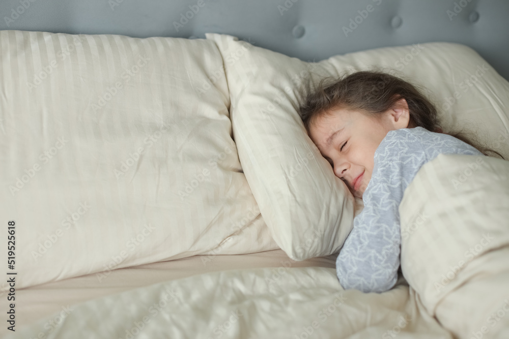 Cute girl sleeping in bed Stock Photo | Adobe Stock