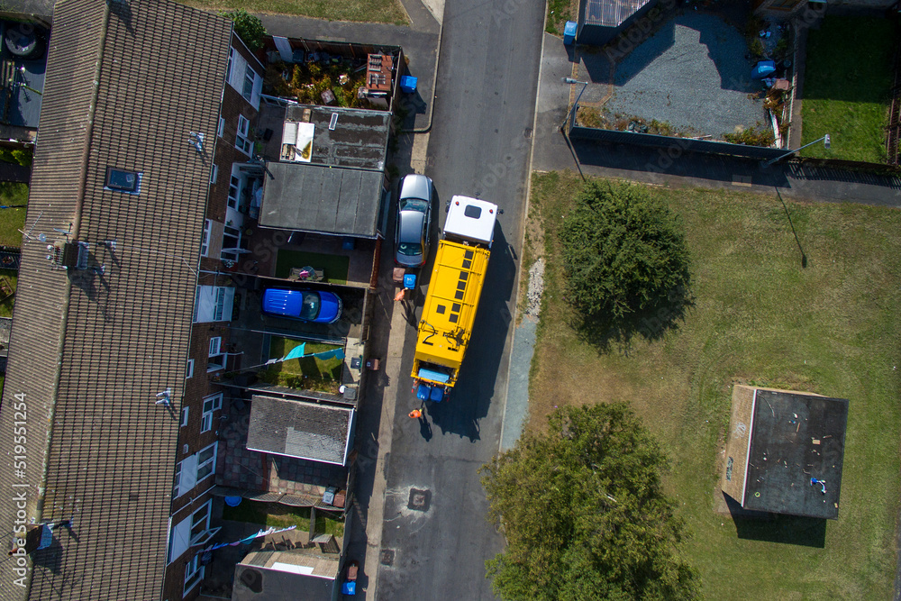 aerial view of refuse collecting lorry collecting domestic rubbish from ...