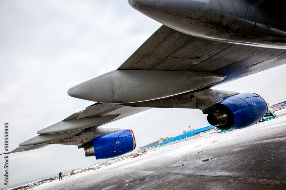 Airplane engine with aircraft wing. Aircraft on runway of airfield ...