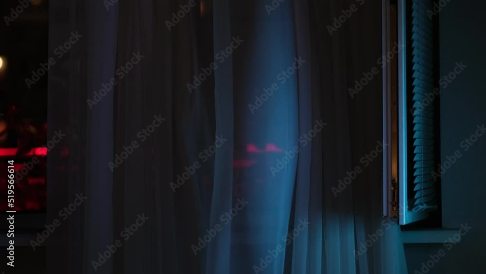 fan on the window creates a flow of fresh air. window with the ...