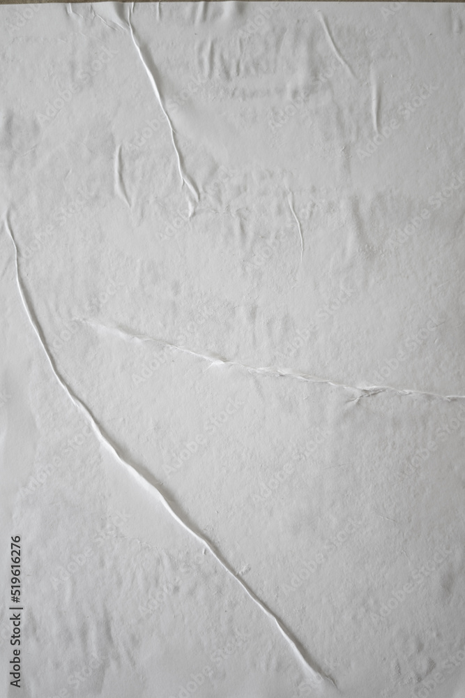 Blank white glued paper for poster texture overlay. Crumpled and wrinkled pattern for background ...