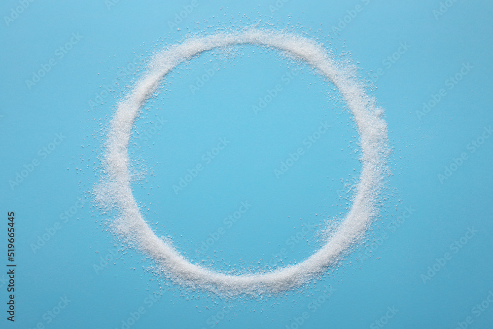 Frame made of granulated sugar on light blue background, top view ...