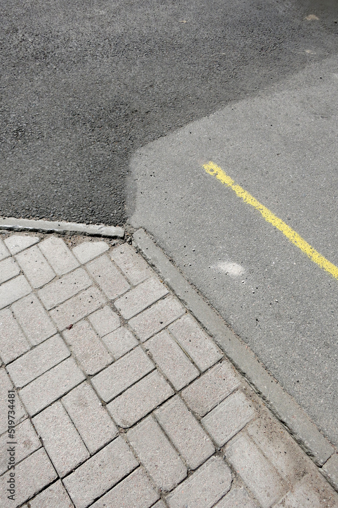 Road. The intersection of the lines of tile masonry and road markings ...