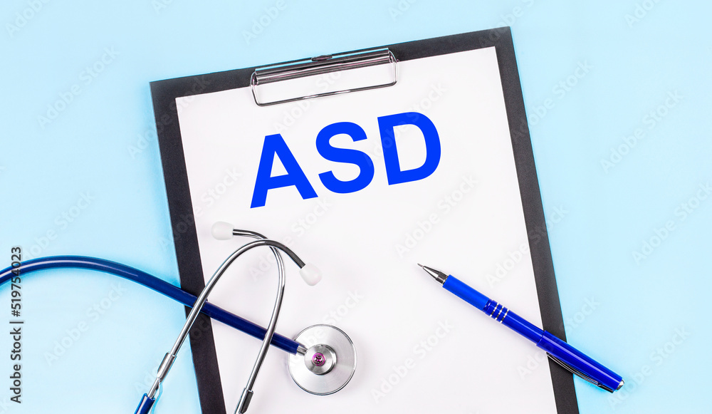 On a blue background, a stethoscope, a pen and a tablet with paper and ...