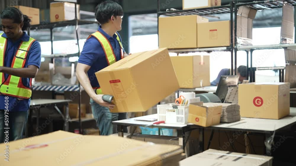 In the warehouse storage areawarehouse staff pulling manual pallet hand ...