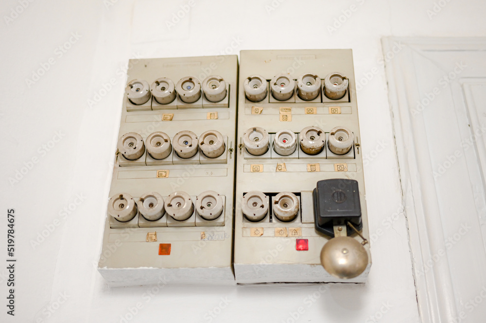 Old electrical fuse box in the house. Old ceramic fuses in building ...