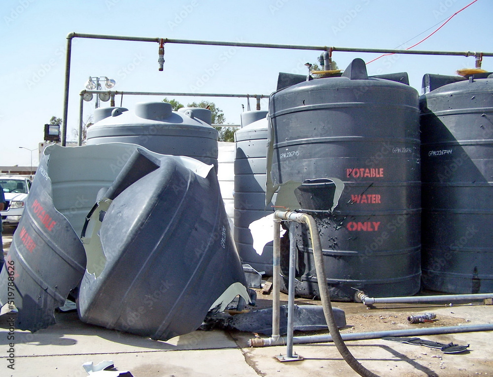 Water tanks destroyed by a mortar round on Camp Victory, Baghdad, Iraq ...