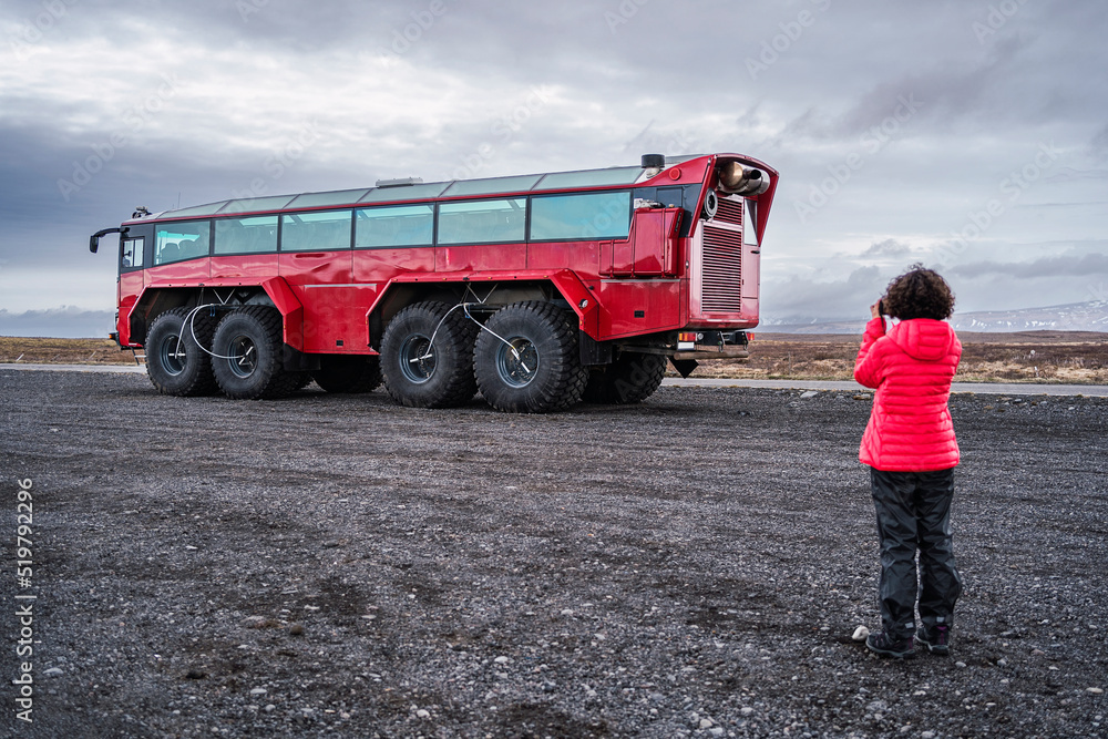 Anonymous lady photographing glacier bus during trip Stock Photo ...