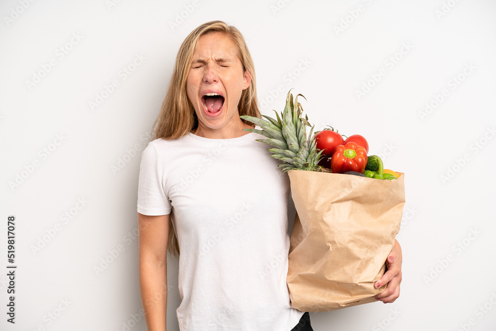 pretty caucasian woman shouting aggressively, looking very angry. chef ...