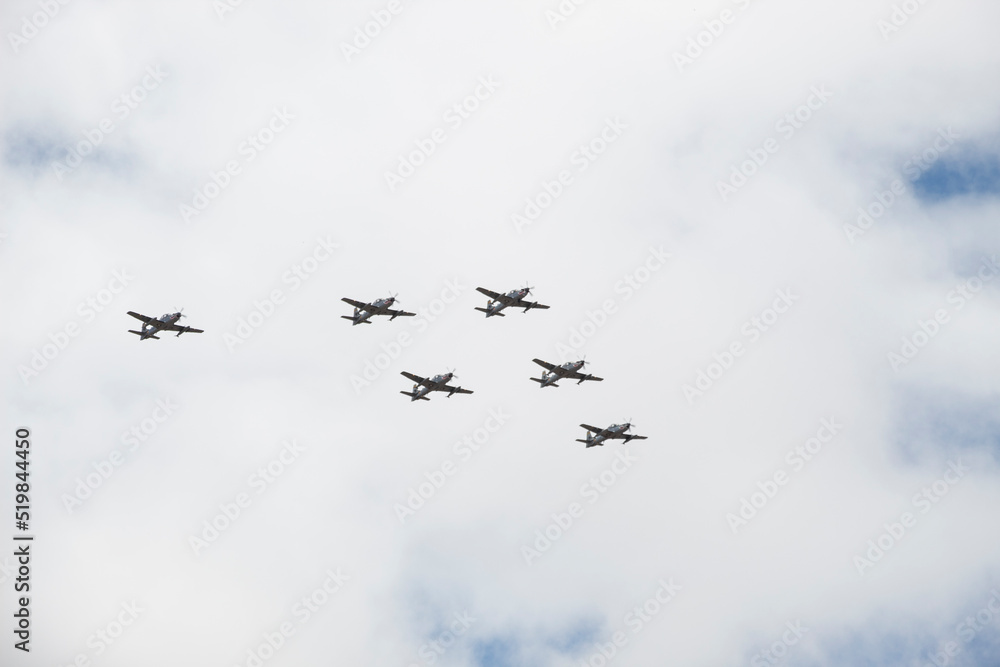 six Super Tucano jet combat planes flight in formation with cloudy and ...
