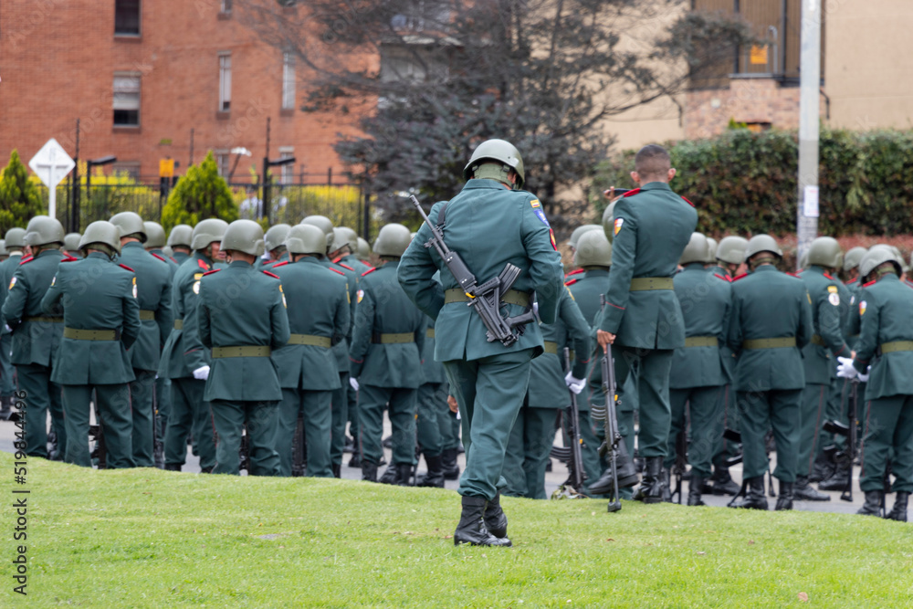 Young soldier with an assault rifle at back walks to join an infantry ...