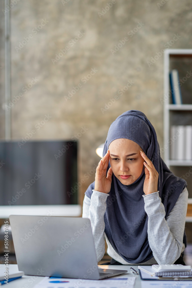 Muslim businesswoman wearing hijab tired sleepy and bored from sitting ...