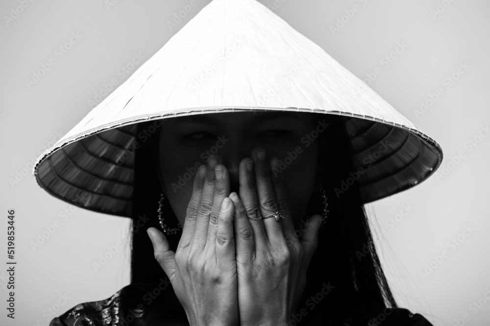 Portrait of Asian woman with cone-shaped Asian cane hat and costume ...