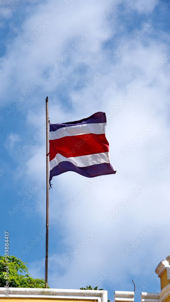 Costa Rican flag flying over a museum in downtown San Jose, Costa Rica ...