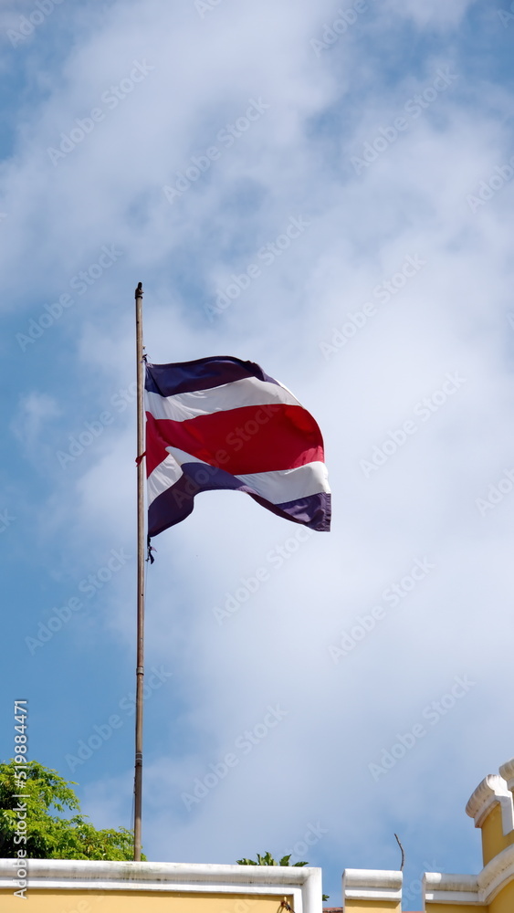 Costa Rican flag flying over a museum in downtown San Jose, Costa Rica ...