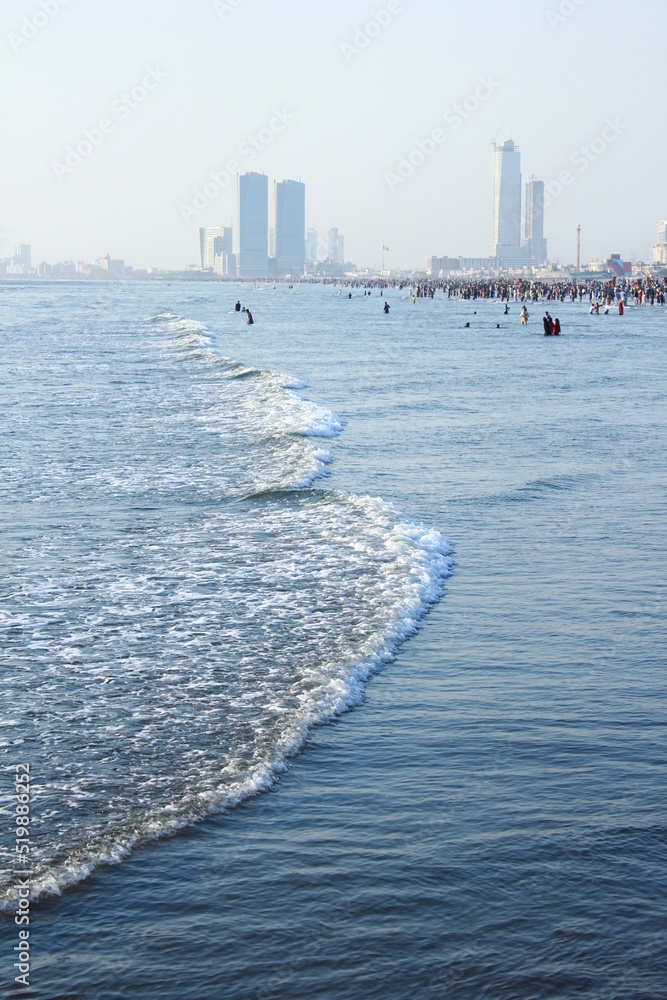 A beautiful picture of seaview wave with buildings karachi sindh ...